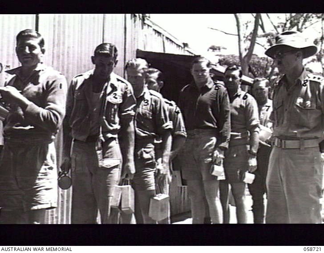 ARDATH AREA, WA. 1943-10-23. LINE UP AT THE MESS PARADE OF THE 9TH ...