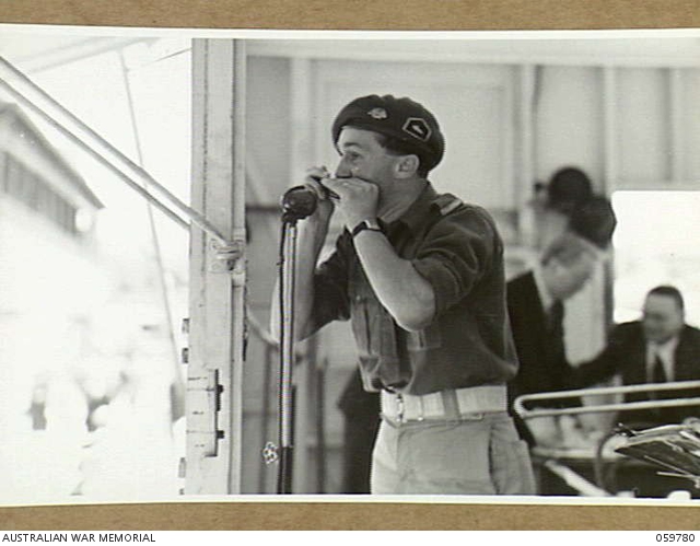 PERTH, WA. 1943-11-09. CORPORAL L. CARR, HARMONICA PLAYER IN THE BAND ...