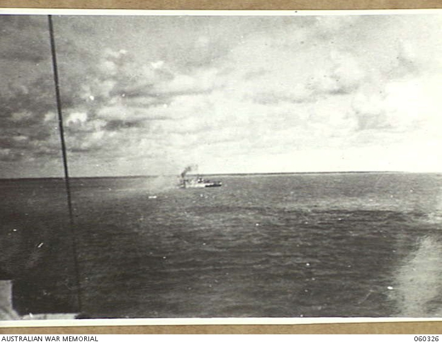 DARWIN, AUS. 1942-02-19. SHIP ON FIRE IN THE HARBOUR DURING THE FIRST ...