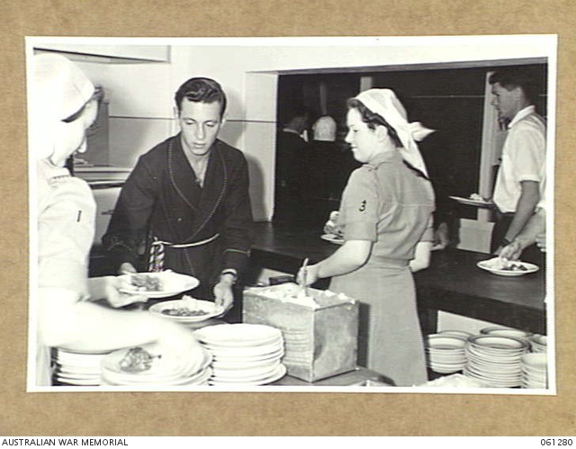HOLLYWOOD, WA. 1943-12-04. SERVING UP MEALS IN THE KITCHEN ATTACHED TO ...
