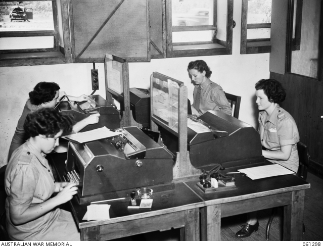 Members of the Australian Women's Army Service operating teleprinters ...