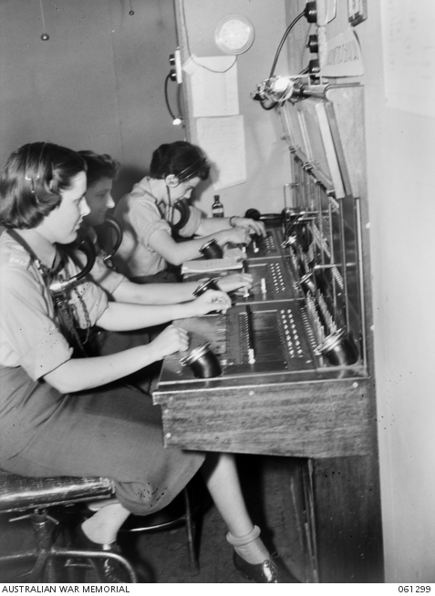 Members of the Australian Women's Army Service operating a telephone ...