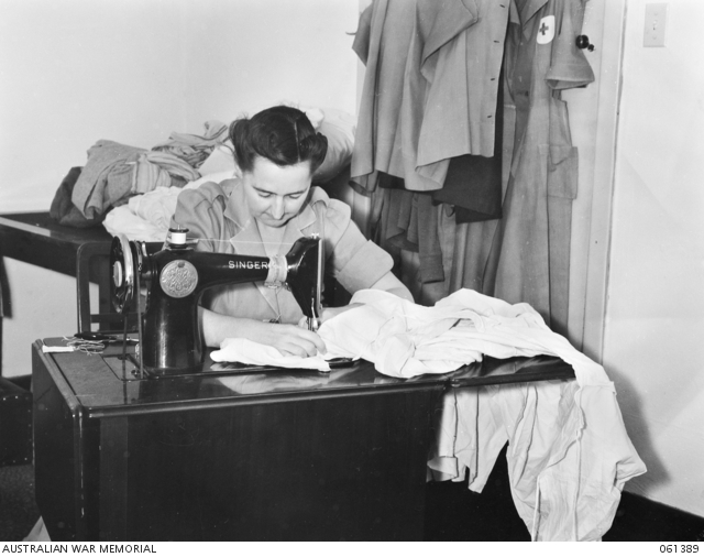 HOLLYWOOD, WA. 1943-12-05. WF97079 CORPORAL R. HOOD, SEAMSTRESS AT THE ...