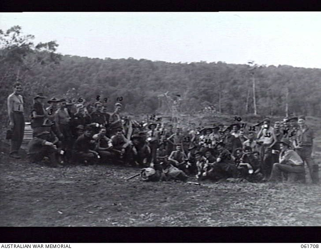 WAREO, NEW GUINEA. 1943-12-09. AS THE FLAG OF THE 2/23RD AUSTRALIAN ...