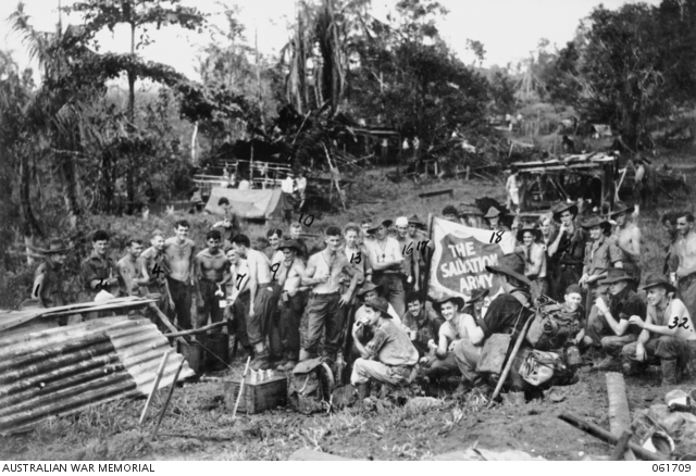 WAREO, NEW GUINEA. 1943-12-09. AS THE FLAG OF THE 2/23RD AUSTRALIAN ...