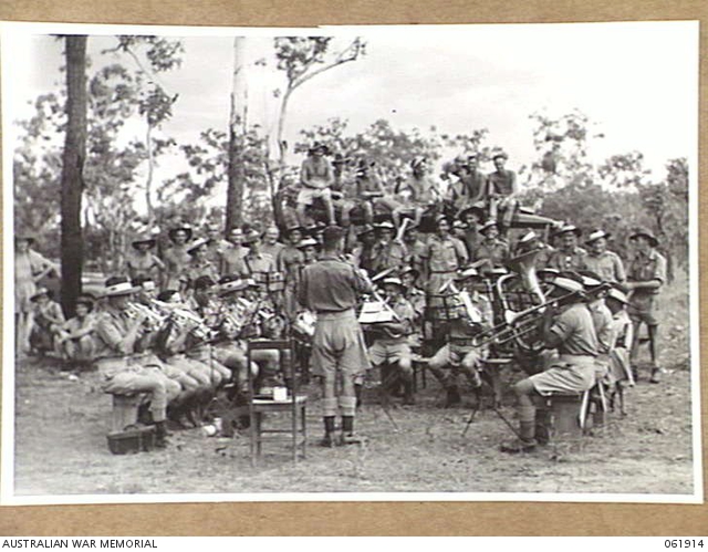 ADELAIDE RIVER, NT. 1943-12-20. ARMY BAND ENTERTAINING THE SPECTATORS ...
