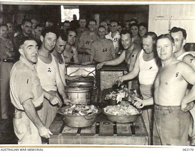 ATHERTON, QLD. 1943-12-25. COOKS AT AUSTRALIAN DETAILS CAMP PREPARE TO ...