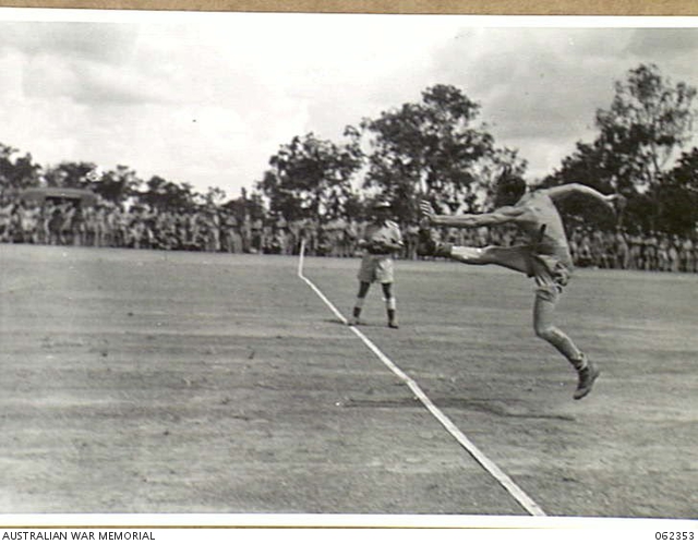 39 MILE, NT. 1943-12-31. PRIVATE RYAN (1) COMPETING IN KICKING THE ...