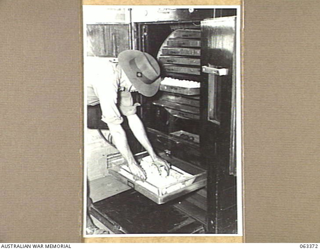 HAY, NSW. 1944-01-16. A MEMBER OF THE 16TH GARRISON BATTALION CHECKING ...