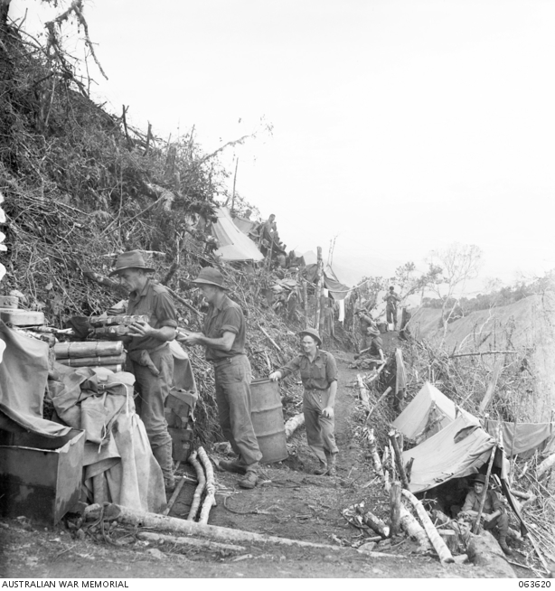 SHAGGY RIDGE, NEW GUINEA. 1944-01-20. MORTAR BOMBS BEING CHECKED BY ...