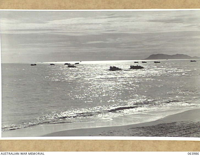 TRINITY BEACH, QLD. 1944-02-01. BARGES OF THE 1ST ORDNANCE BEACH ...