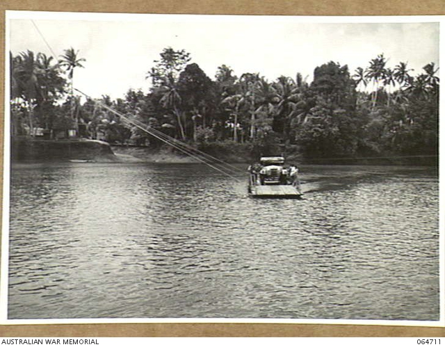 AUGURUWATOTA, CEYLON. 1942-06. THE FLYING BRIDGE OR PUNT MOVING ACROSS ...