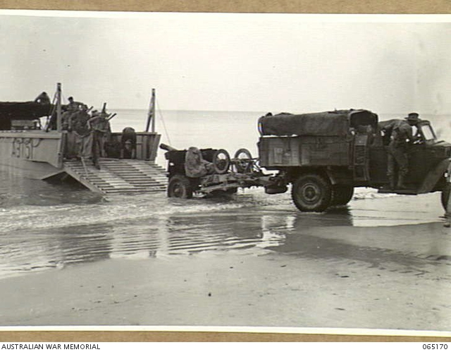 PORT DOUGLAS, QLD. 1944-03-17. A 25 POUNDER GUN BEING TOWED ASHORE FROM ...