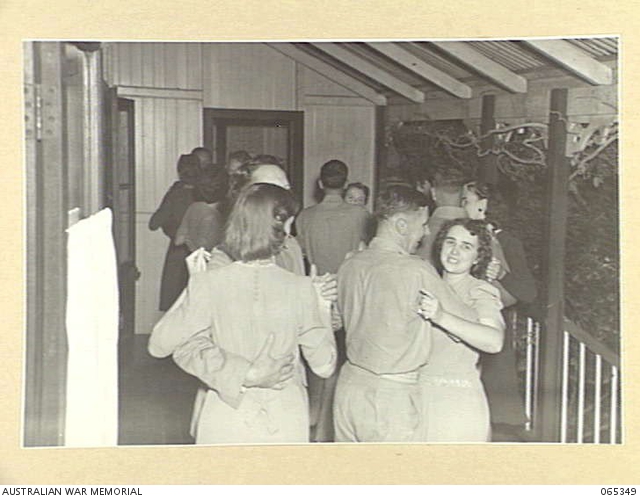 MALANDA, QLD. 1944-03-22. SERVICE PERSONNEL AND CIVILIANS DANCING ON ...