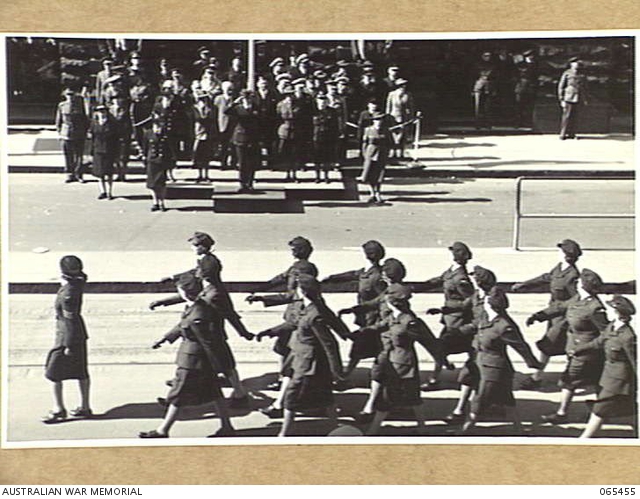 MELBOURNE, VIC. 1944-04-14. MEMBERS OF THE WAAAF GIVE "EYES RIGHT" AS ...