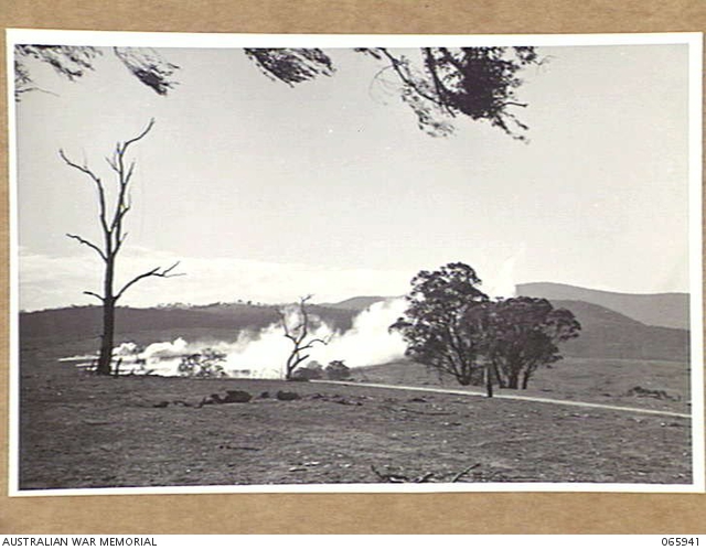 BATHURST, NSW. 1944-04-19. SMOKE BOMBS EXPLODING ON THE MORTAR TARGET ...