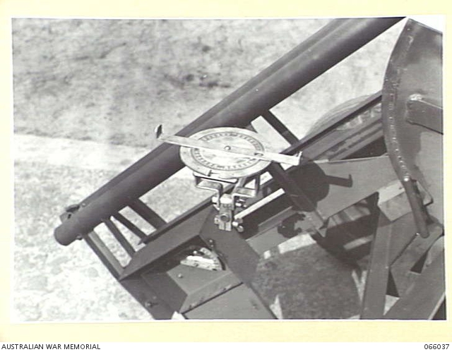 SYDNEY, NSW. 1944-04-27. THE DIAL SIGHT OF A PROJECTOR, TARGET ROCKET ...
