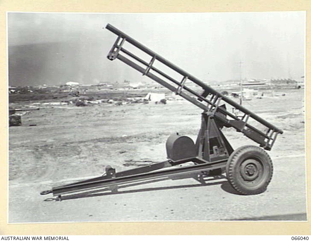 SYDNEY, NSW. 1944-04-27. A SIDE VIEW OF A PROJECTOR, TARGET ROCKET ...