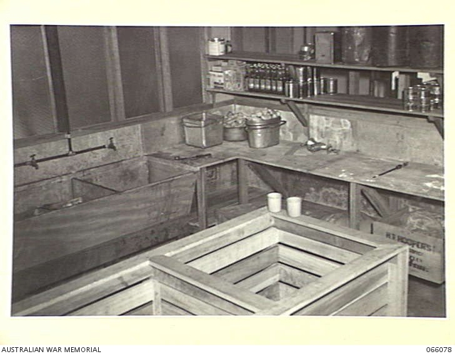ROCKY CREEK, QLD. 1944-04-27. FOOD PREPARATION ROOM IN A CORNER OF THE ...