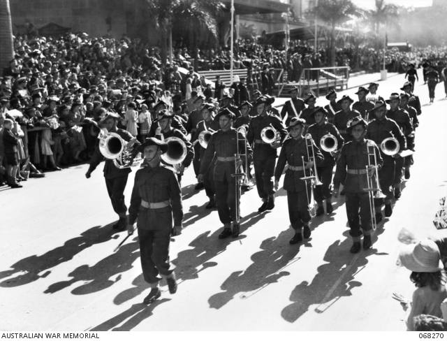 BRISBANE, QLD. 1944-08-08. THE BAND OF THE 18TH INFANTRY BRIGADE MOVING ...
