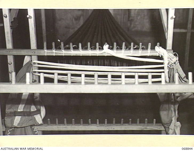 MAREEBA, NORTH QUEENSLAND, AUSTRALIA. 1944-08-10. A PARACHUTE DRYING ON ...