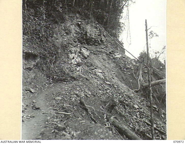 ZENAG, NEW GUINEA, 1944-02-28. IN ORDER TO WIDEN THE EXISTING TRACK ...