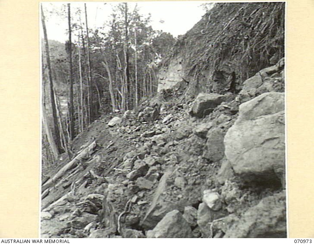ZENAG, NEW GUINEA, 1944-02-28. IN ORDER TO WIDEN THE EXISTING TRACK ...