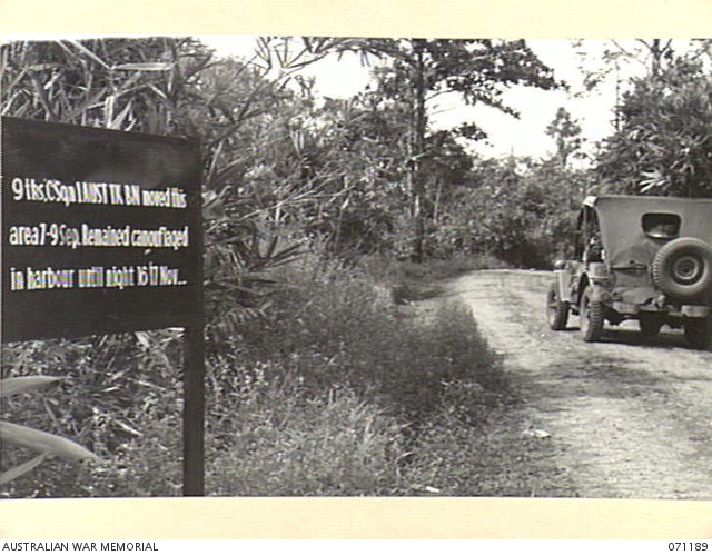 FINSCHHAFEN AREA, NEW GUINEA. 1944-03-17. ONE OF MANY BATTLE SIGNS IN ...