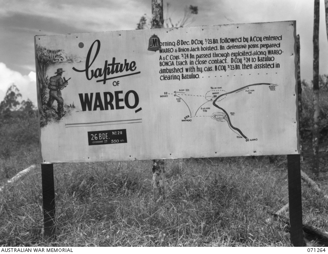 FINSCHHAFEN AREA, NEW GUINEA. 1944-03-18. ONE OF MANY BATTLE SIGNS IN ...