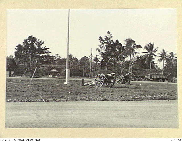 LAE, NEW GUINEA. 1944-03-24. ADMINISTRATION BUILDINGS VIEWED FROM THE ...