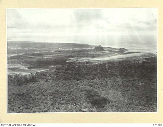 LAE, NEW GUINEA. 1944-03-30. LAE AIRFIELD VIEWED FROM THE AIR WITH THE ...