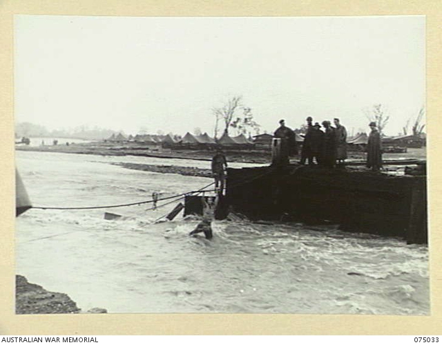 LAE, NEW GUINEA. 1944-08-09. TROOPS OF THE 20TH FIELD COMPANY GETTING A ...