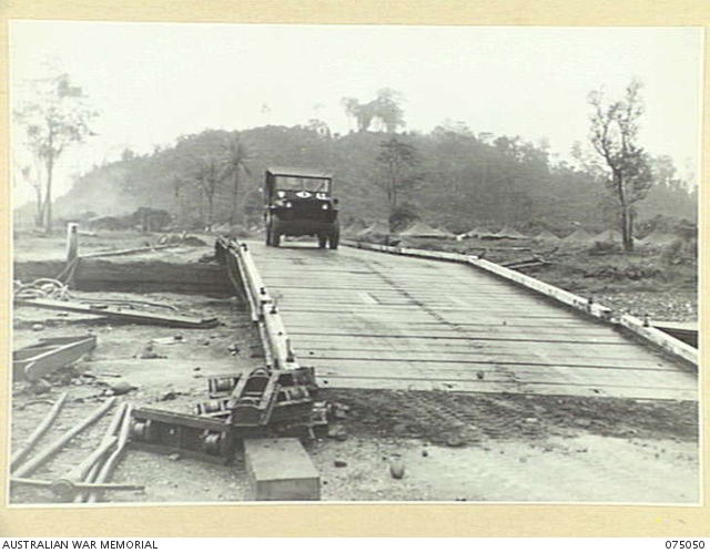 LAE, NEW GUINEA. 1944-08-09. THE RECENTLY COMPLETED STEEL BRIDGE ACROSS ...