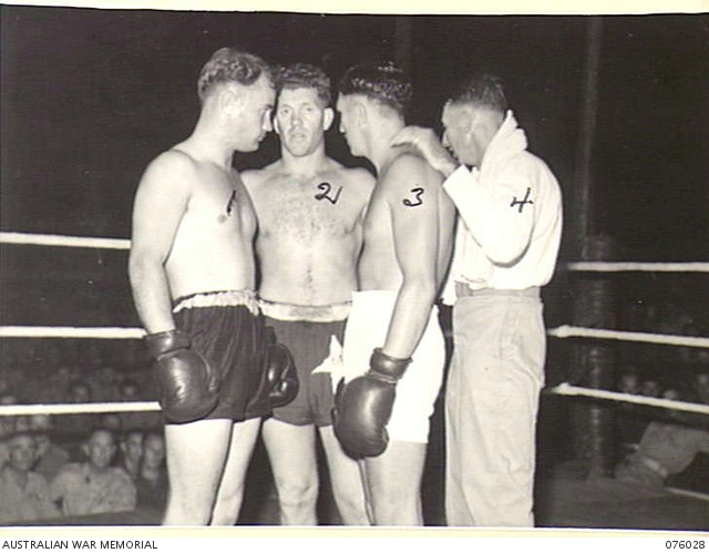 MADANG, NEW GUINEA. 1944-09-16. BOXERS BEING INTRODUCED TO THE AUDIENCE ...