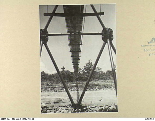 LAE, NEW GUINEA. 1944-10-18. THE SUSPENSION BRIDGE BUILT ACROSS THE ...