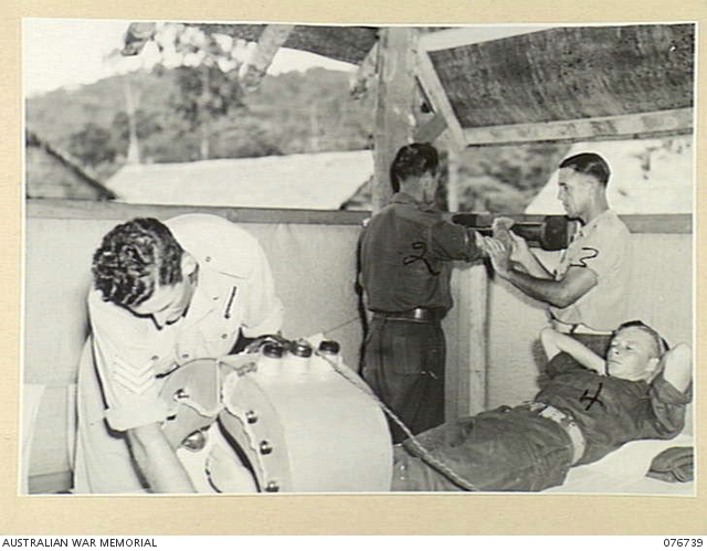 LAE, NEW GUINEA. 1944-11-09. CORPORAL W. TAYLOR (3) AND SERGEANT D ...