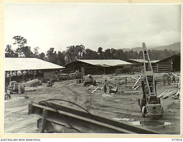 LAE BASE AREA, NEW GUINEA. 1944-12-27. NEW BUILDINGS UNDER CONSTRUCTION ...