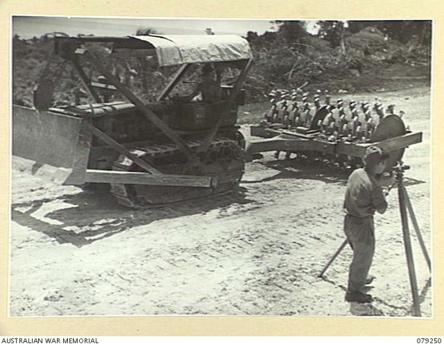 PALMALMAL PLANTATION, NEW BRITAIN. 1945-02-14. A TRACTOR AND SHEEPSFOOT ...
