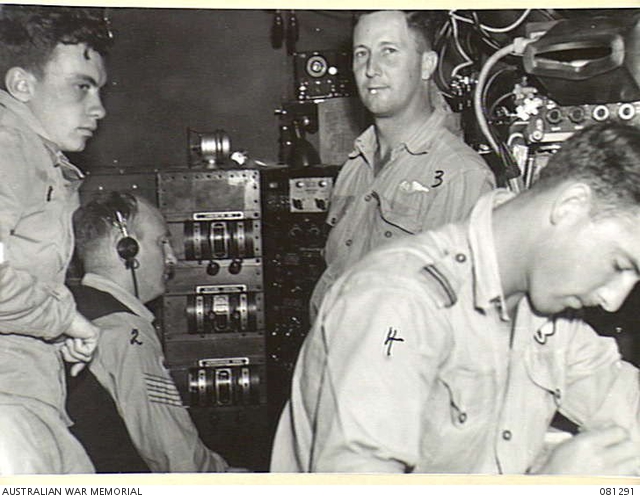 THE NAVIGATOR, ENGINEER, WIRELESS OPERATOR AND RIGGER, AT THE FLIGHT ...