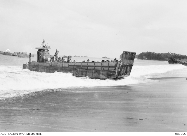 AITAPE BEACH HEAD, NEW GUINEA. 1944-11-26. A LANDING BARGE CARRYING 6 ...