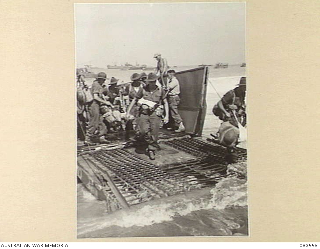 AITAPE BEACH HEAD, NEW GUINEA. 1944-11-26. GEAR LADEN 6 DIVISION ...