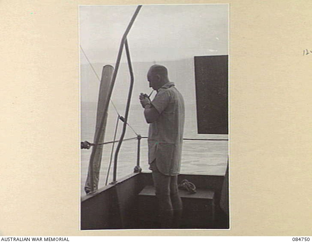 AT SEA. 1944-11-12. LIEUTENANT COMMANDER GRIFFITHS, CAPTAIN OF THE ...