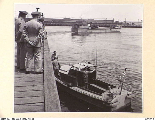 APPLETON DOCKS, MELBOURNE, VIC. 1945-01-09. WATCHED BY SENIOR OFFICERS ...