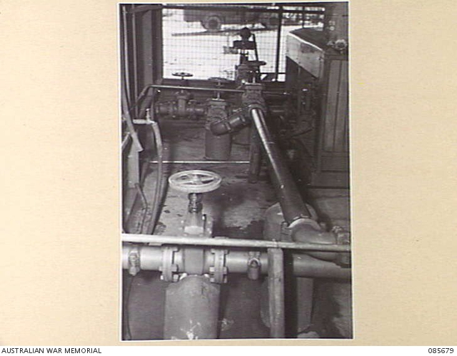 DARWIN, AUSTRALIA. 1945-01-24. THE INTERIOR OF A SMALL PUMPING STATION ...