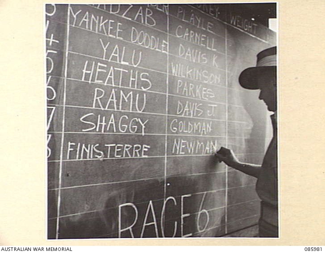 KULARA, QLD. 1945-01-27. SERGEANT E J POWER, CHALKING ENTRIES IN THE ...