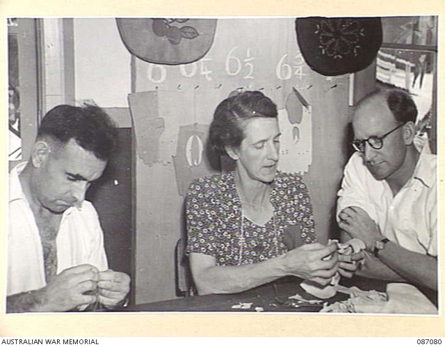SYDNEY, NSW. 1945-03-01. MISS THATCHER, (2), INSTRUCTING CPL F.A ...