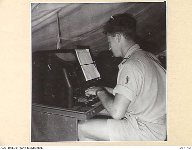 BALCOMBE, VIC. 1945-03-06. AN OPERATOR MANNING A TELEPRINTER DURING THE ...