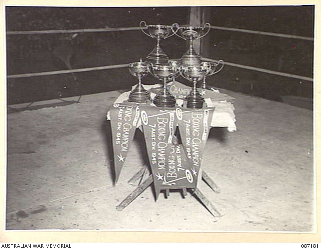 KAIRI, QLD. 1945-02-17. TROPHIES IN THE RING AT THE 7 DIVISION BOXING ...