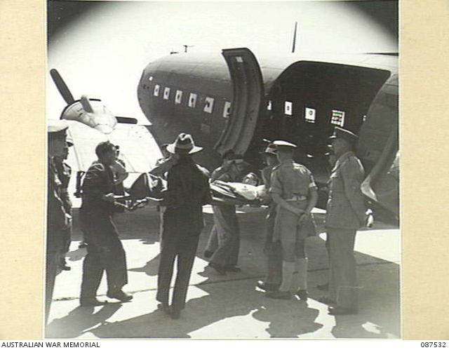 MELBOURNE, VICTORIA. 1945-03-15. STRETCHER CASES BEING LOADED ABOARD A ...