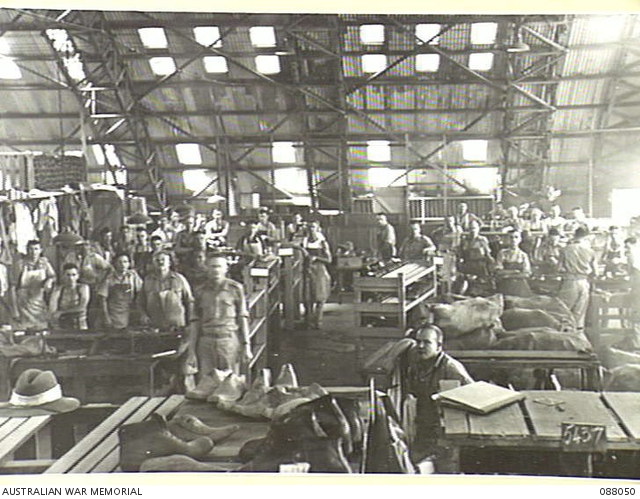 REDBANK, QUEENSLAND. 1945-04-04. THE INTERIOR OF THE BOOT REPAIR SHOP ...